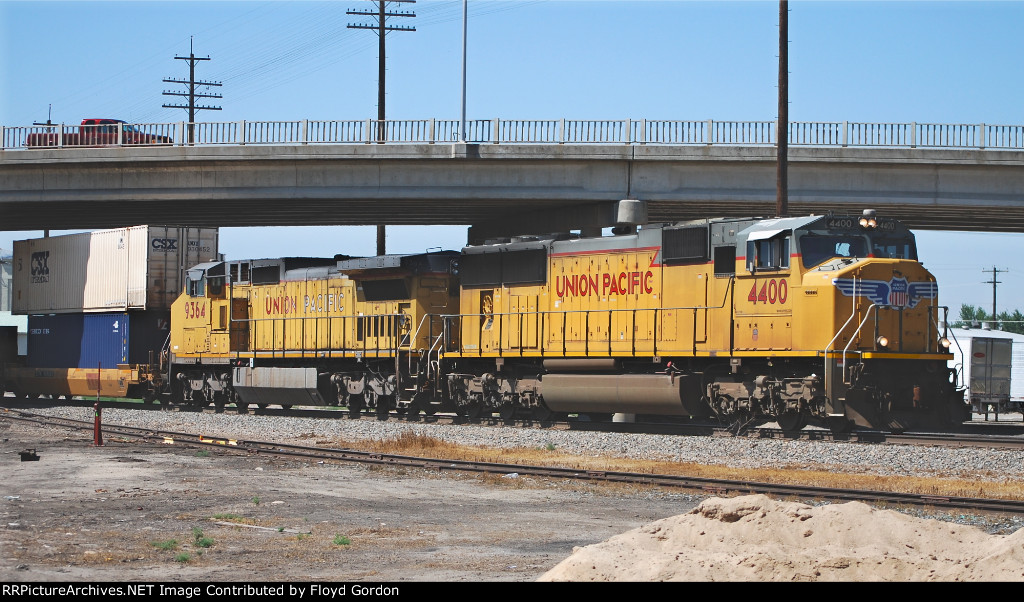 UP 4400 and UP 9364 head westward with double stack train